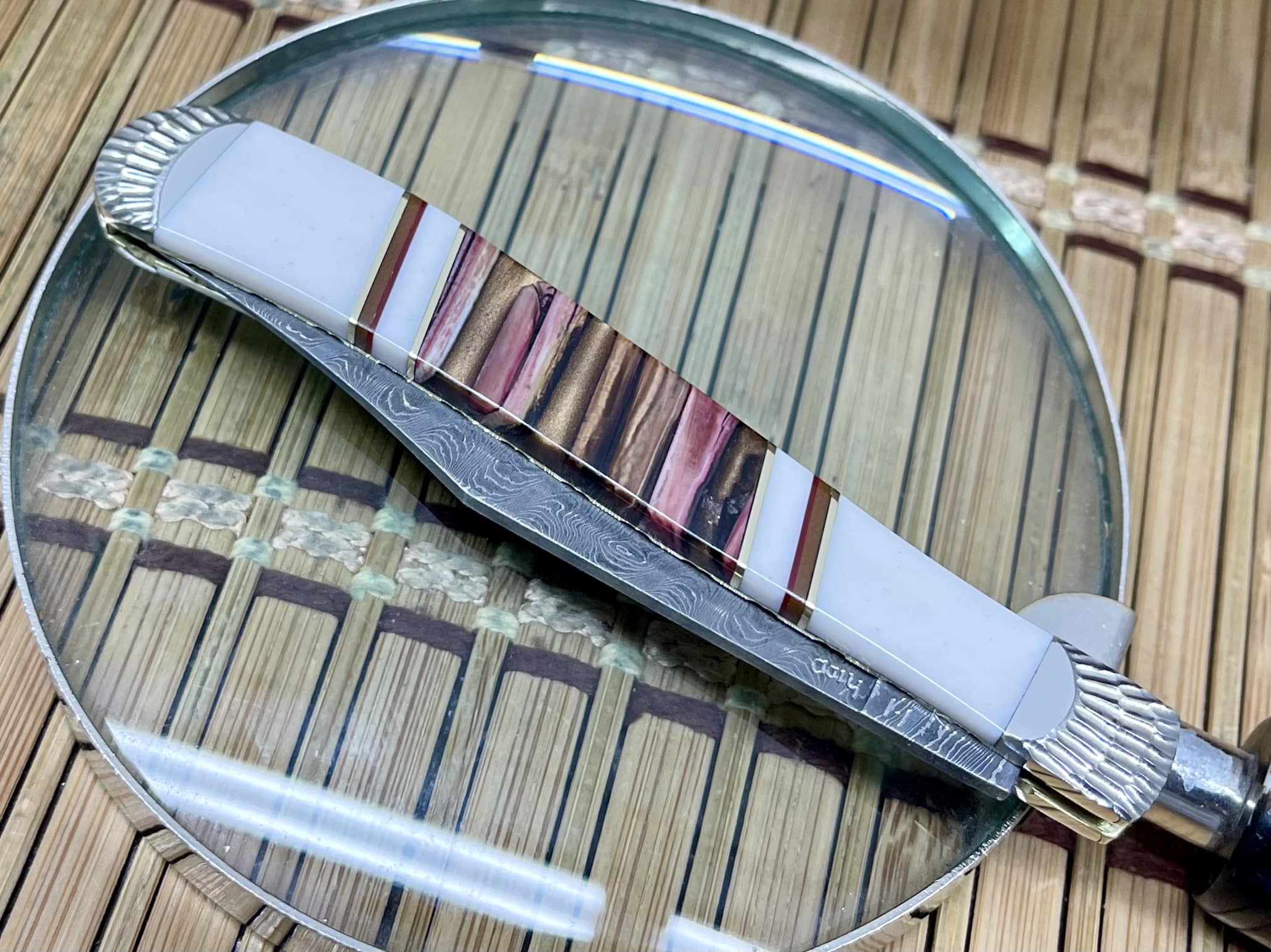 Exotic case red mammoth fossil damascus slimline 1/1